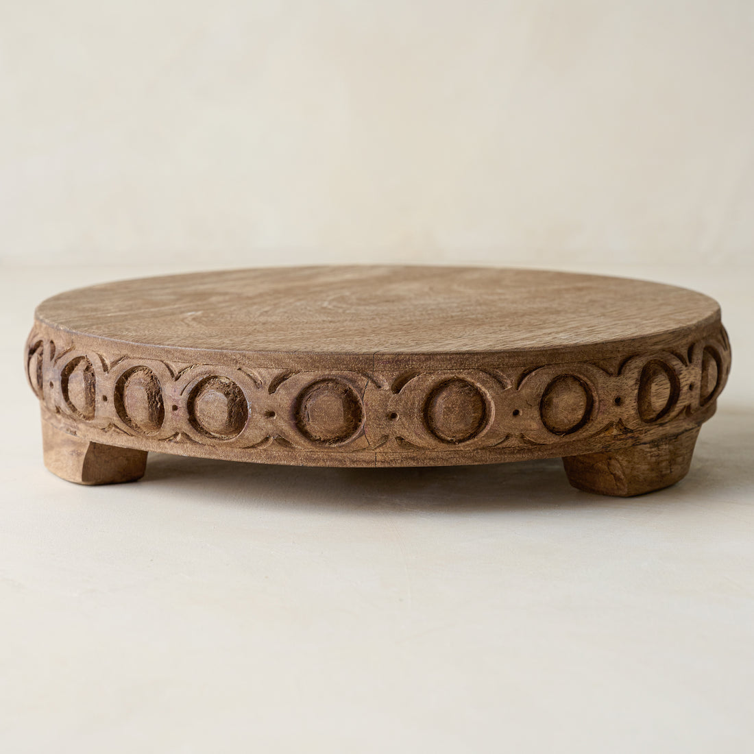 Antiqued Carved Wood Round Riser – Magnolia